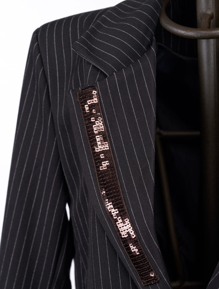 Long black pinstripe jacket. - Save The Queen!
